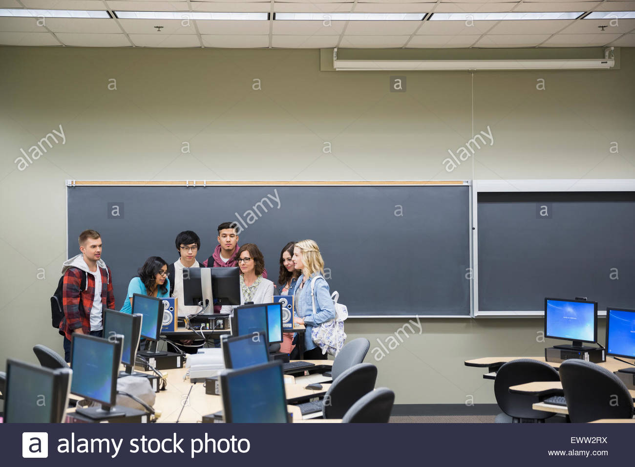 Young students around computer hi-res stock photography and images - Alamy