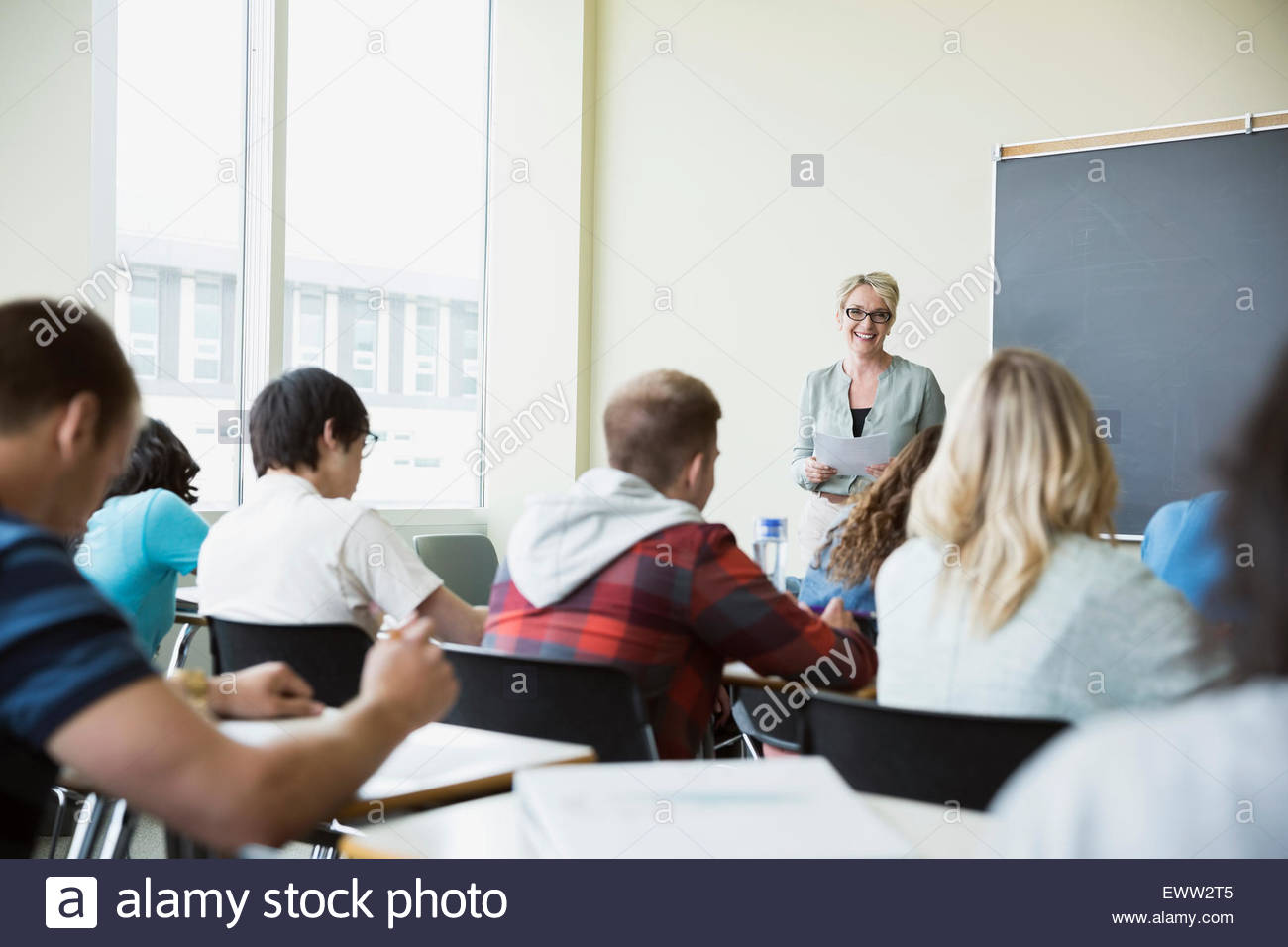 College professor teaching lesson in classroom Stock Photo - Alamy