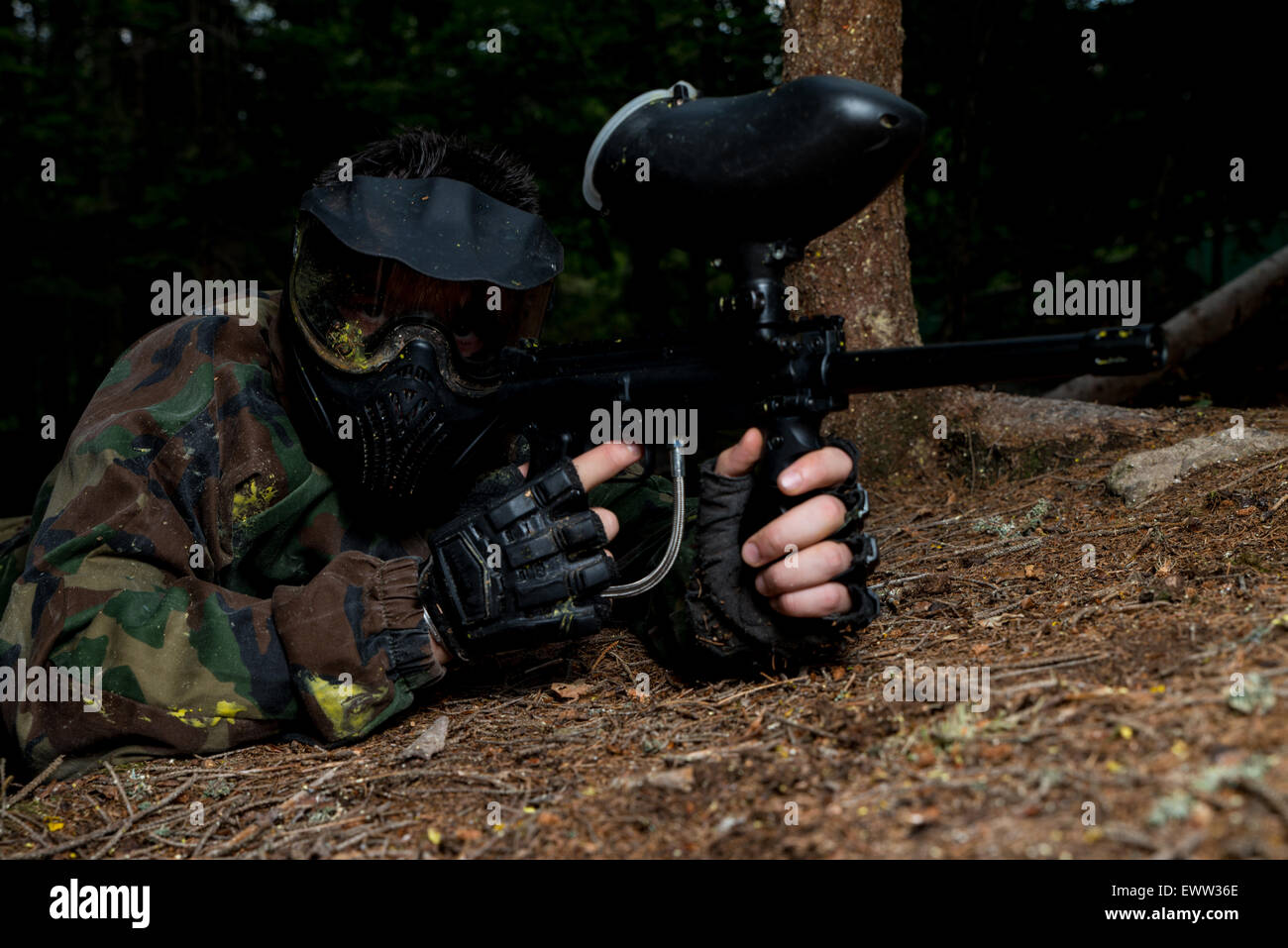 Paintball player Lying Down Stock Photo - Alamy