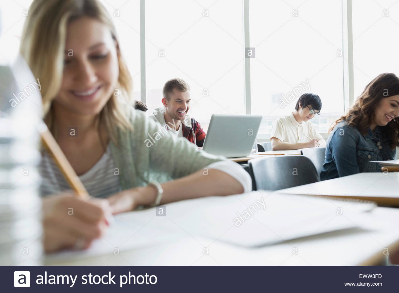 College students studying in classroom Stock Photo - Alamy