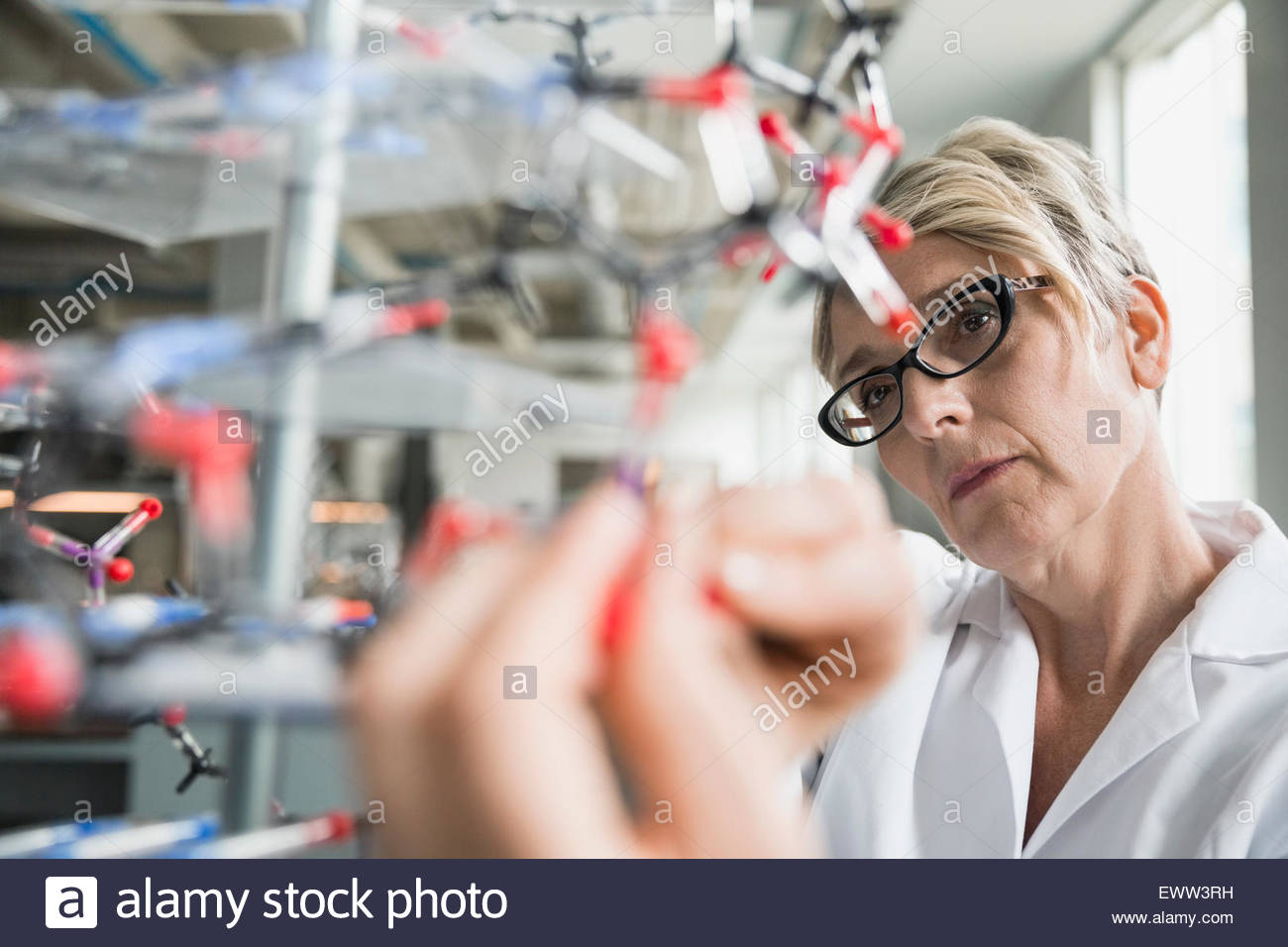 Close up scientist examining molecule hi-res stock photography and ...