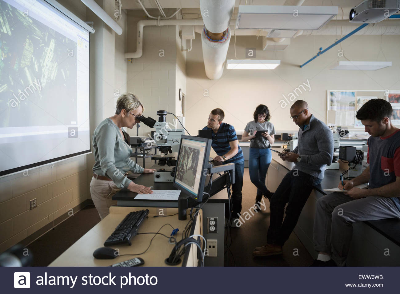 Group science man projector hi-res stock photography and images - Alamy