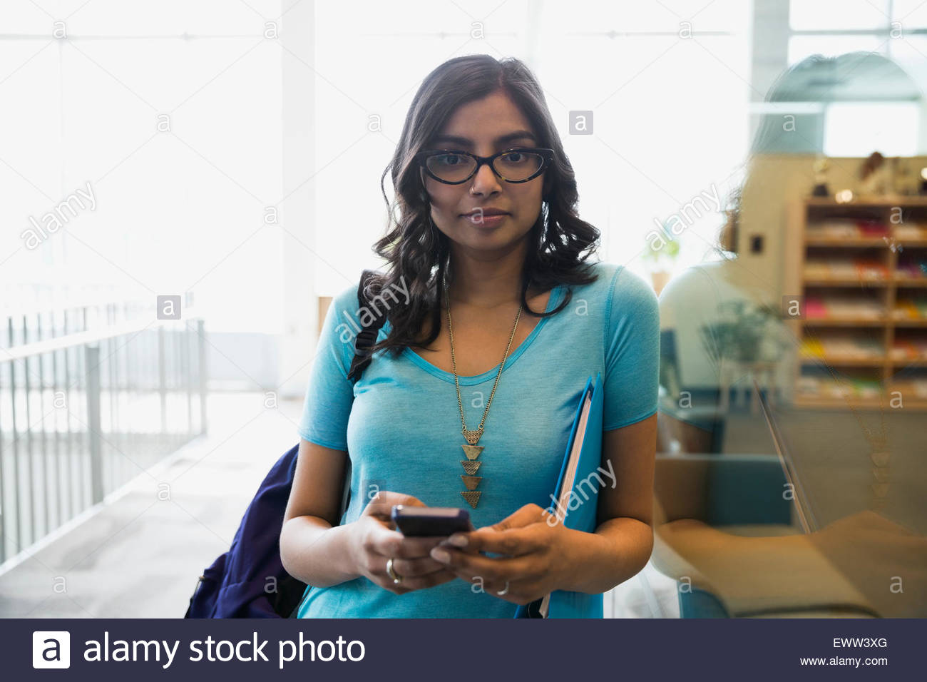 College student texting and reading hi-res stock photography and images ...