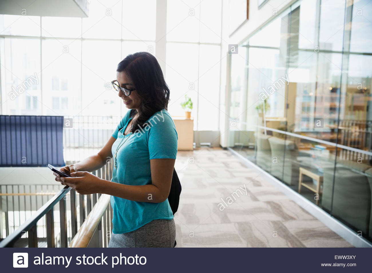 College student texting and reading hi-res stock photography and images ...