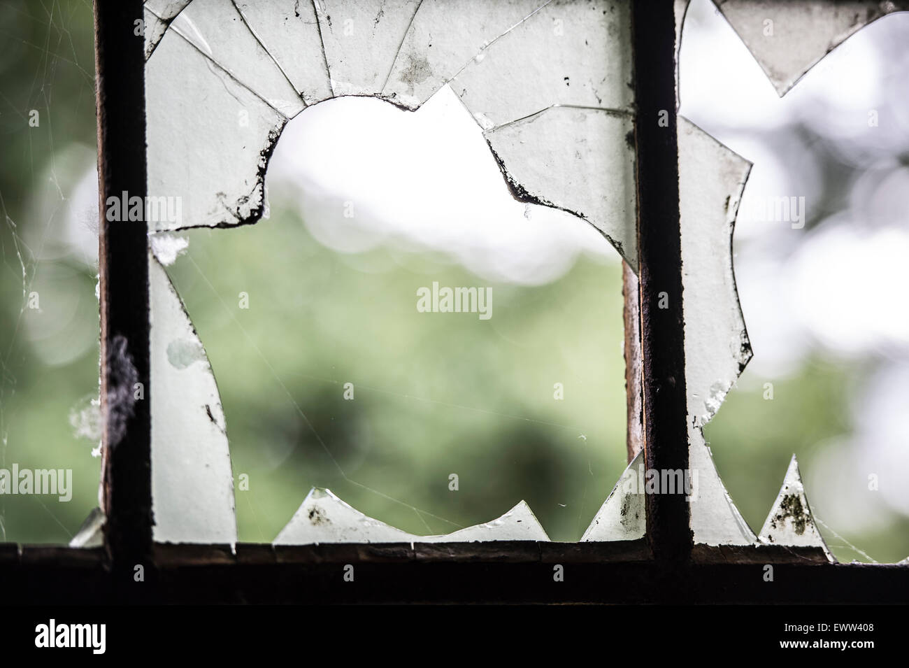 Broken windows on a derelict building Stock Photo - Alamy
