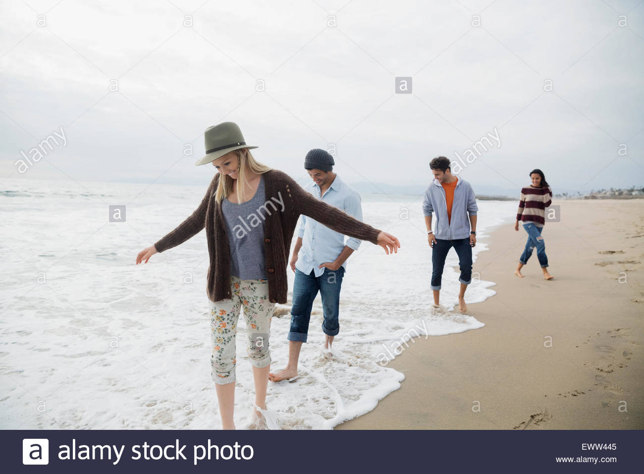 Woman wading on beach hi-res stock photography and images - Alamy