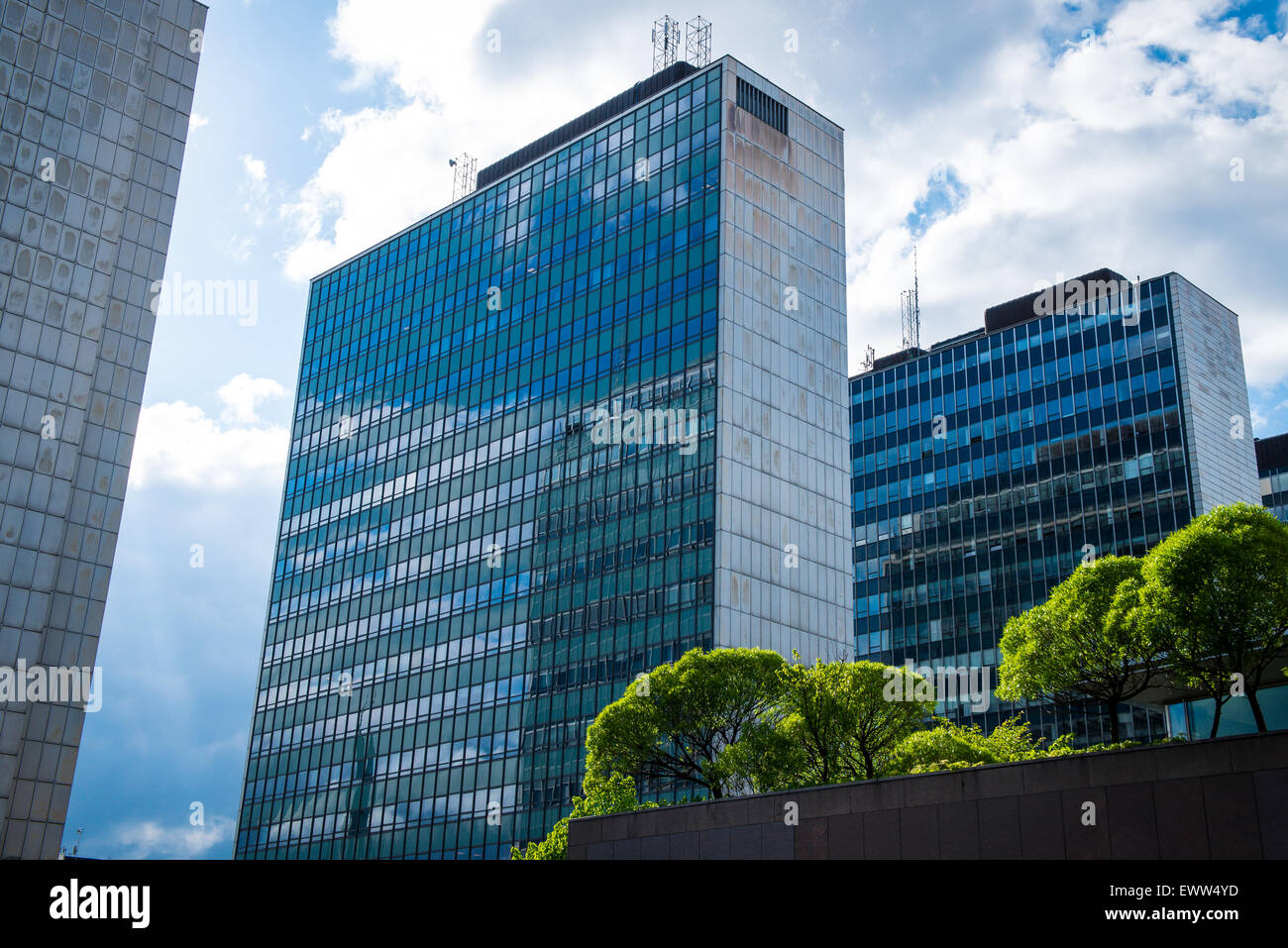 Photo of the office buildings with glass windows. Sky in the background ...
