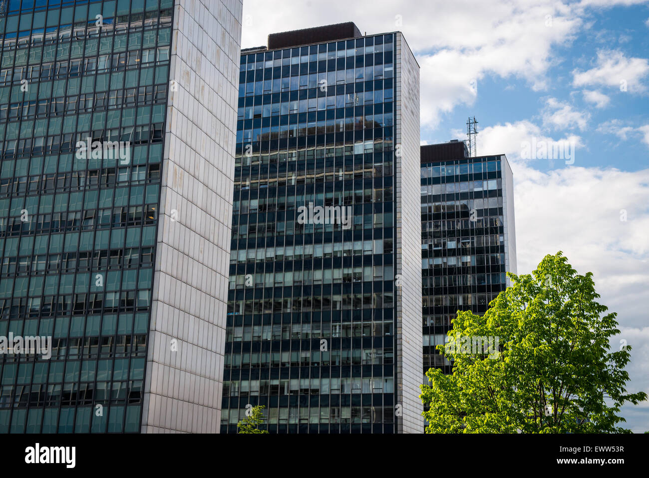 Photo of the office buildings with glass windows. Sky in the background ...