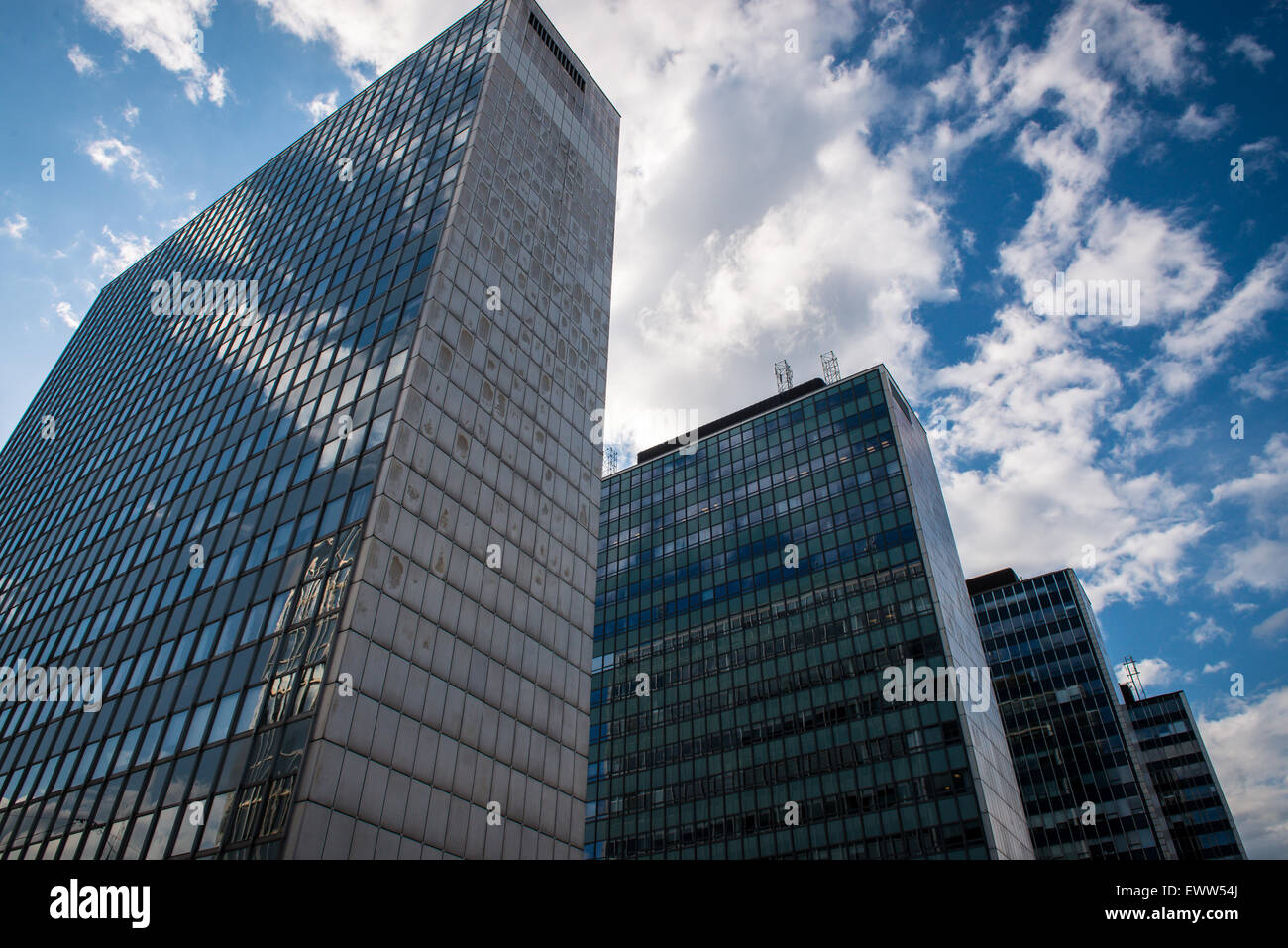 Photo of the office buildings with glass windows. Sky in the background ...