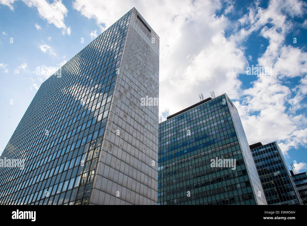 Photo of the office buildings with glass windows. Sky in the background ...