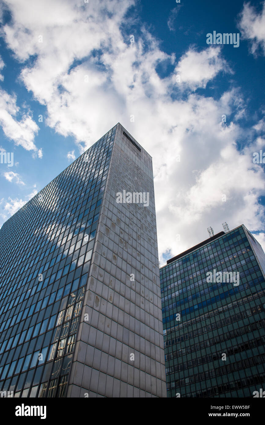 Photo of the office buildings with glass windows. Sky in the background ...