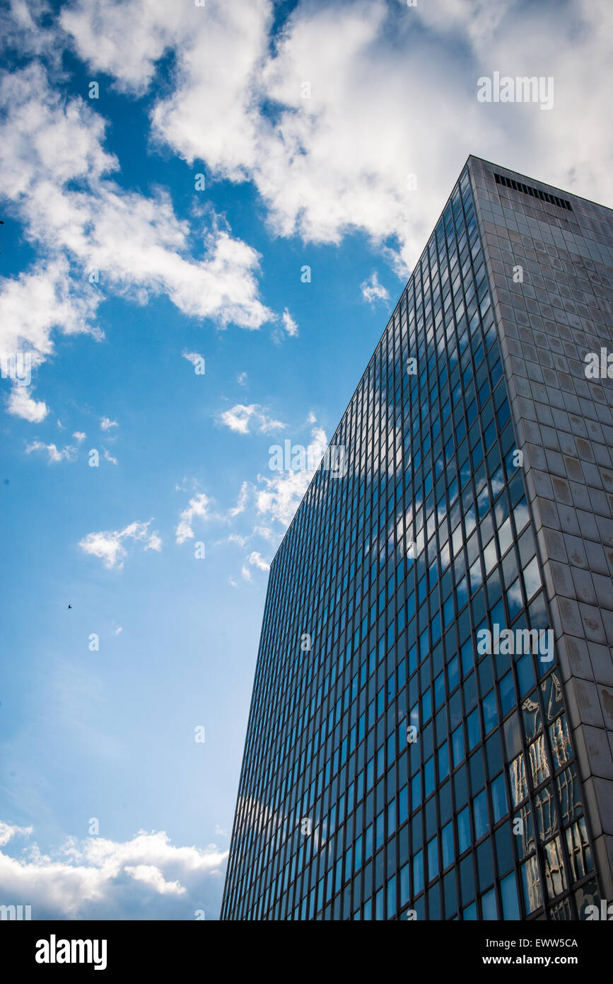 Photo of the office buildings with glass windows. Sky in the background ...