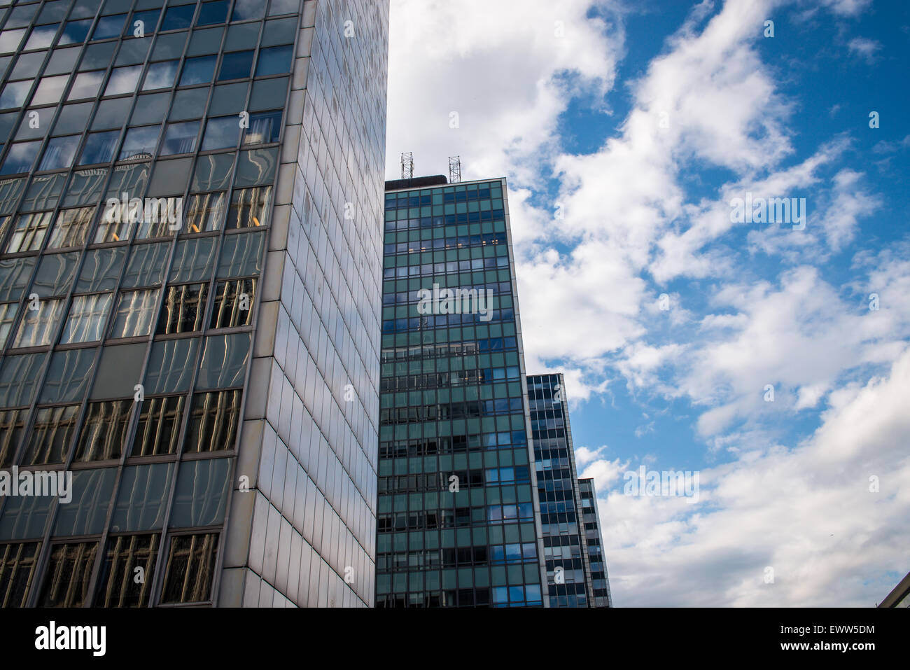 Photo of the office buildings with glass windows. Sky in the background ...
