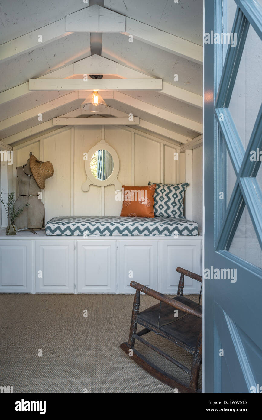 Guest room with window seat and rocking chair Stock Photo - Alamy