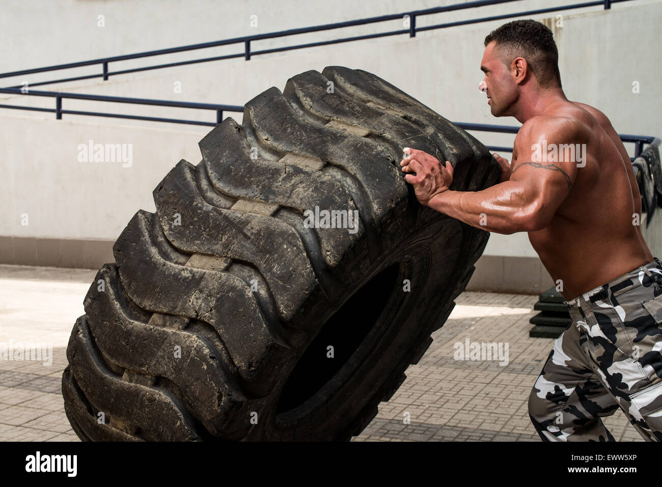Men building tires hi-res stock photography and images - Alamy