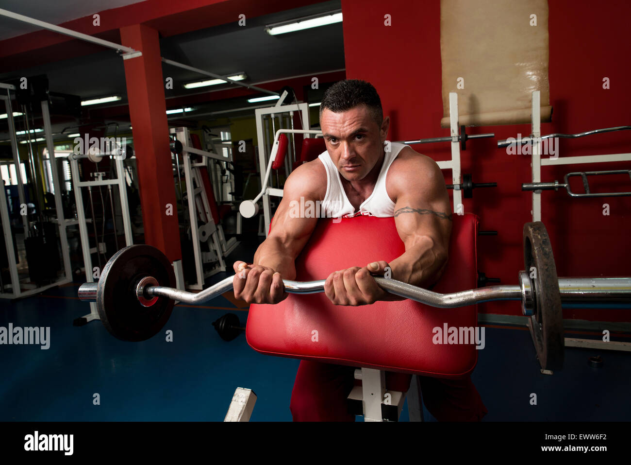 Bodybuilder Doing Heavy Barbell Exercise Stock Photo - Alamy