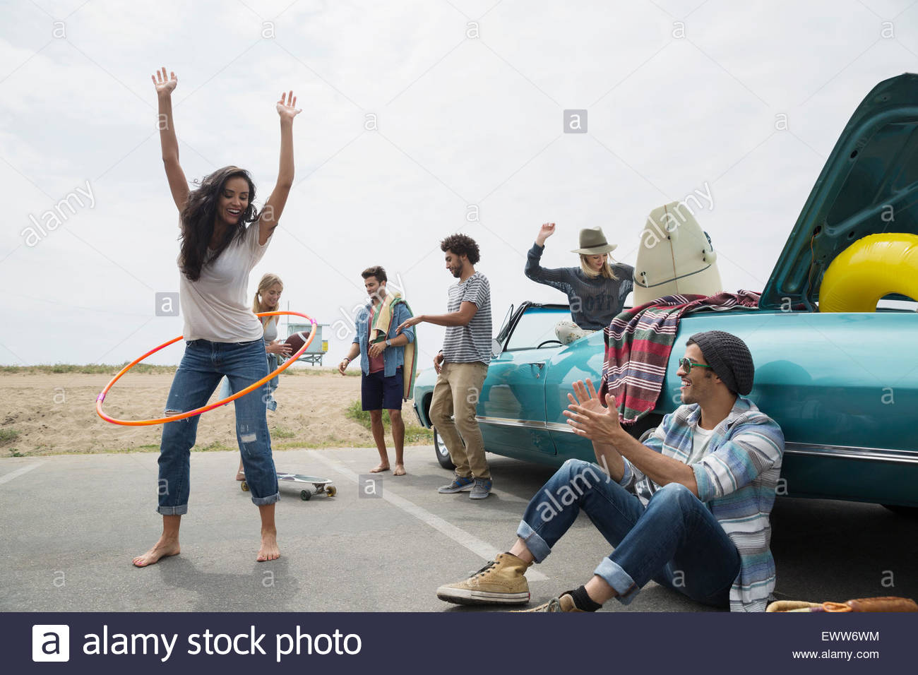 Friends hanging out around convertible hi-res stock photography and ...