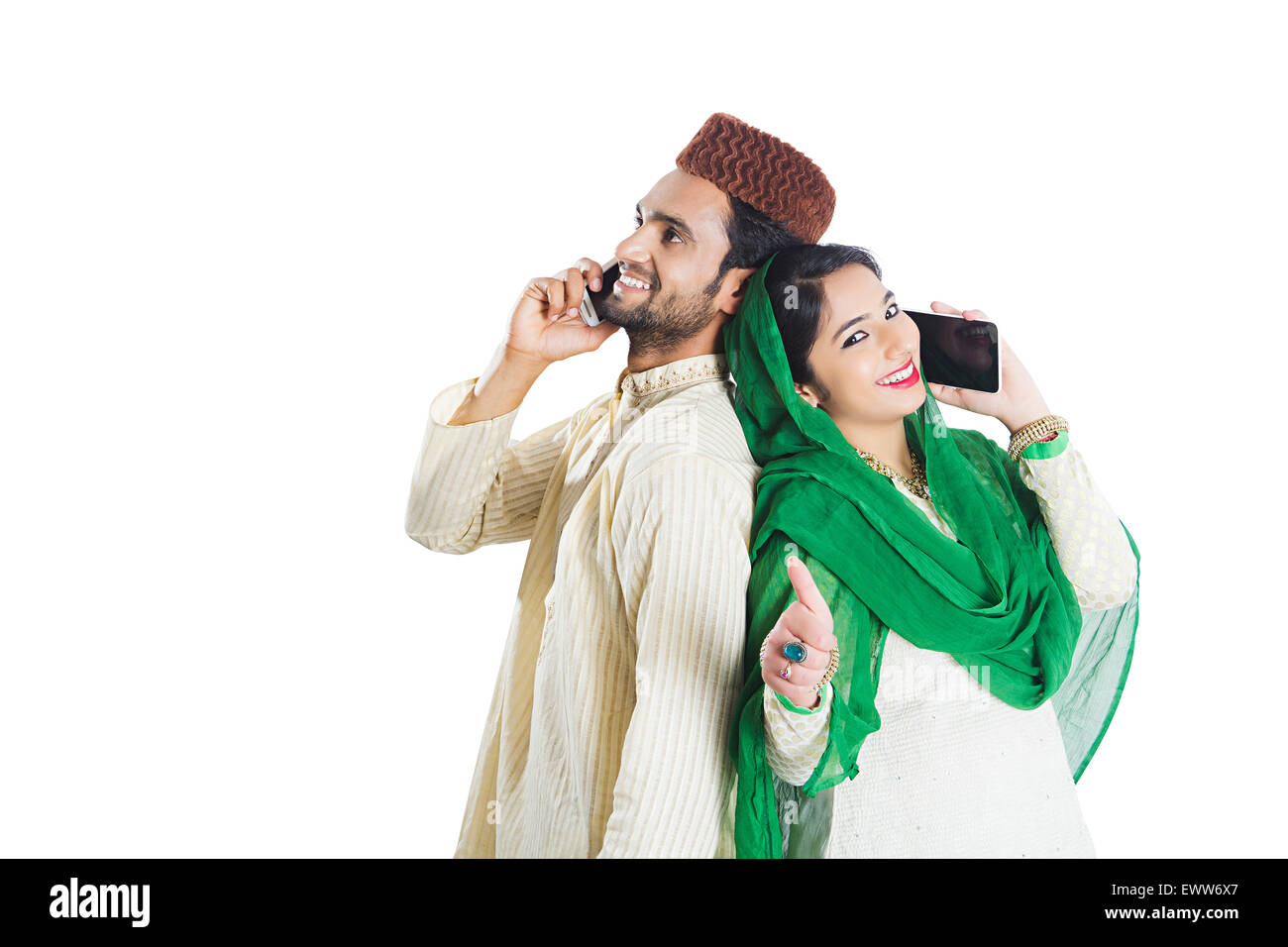 2 indian Muslim Married Couple talking Cell Phone and thumbs up showing ...