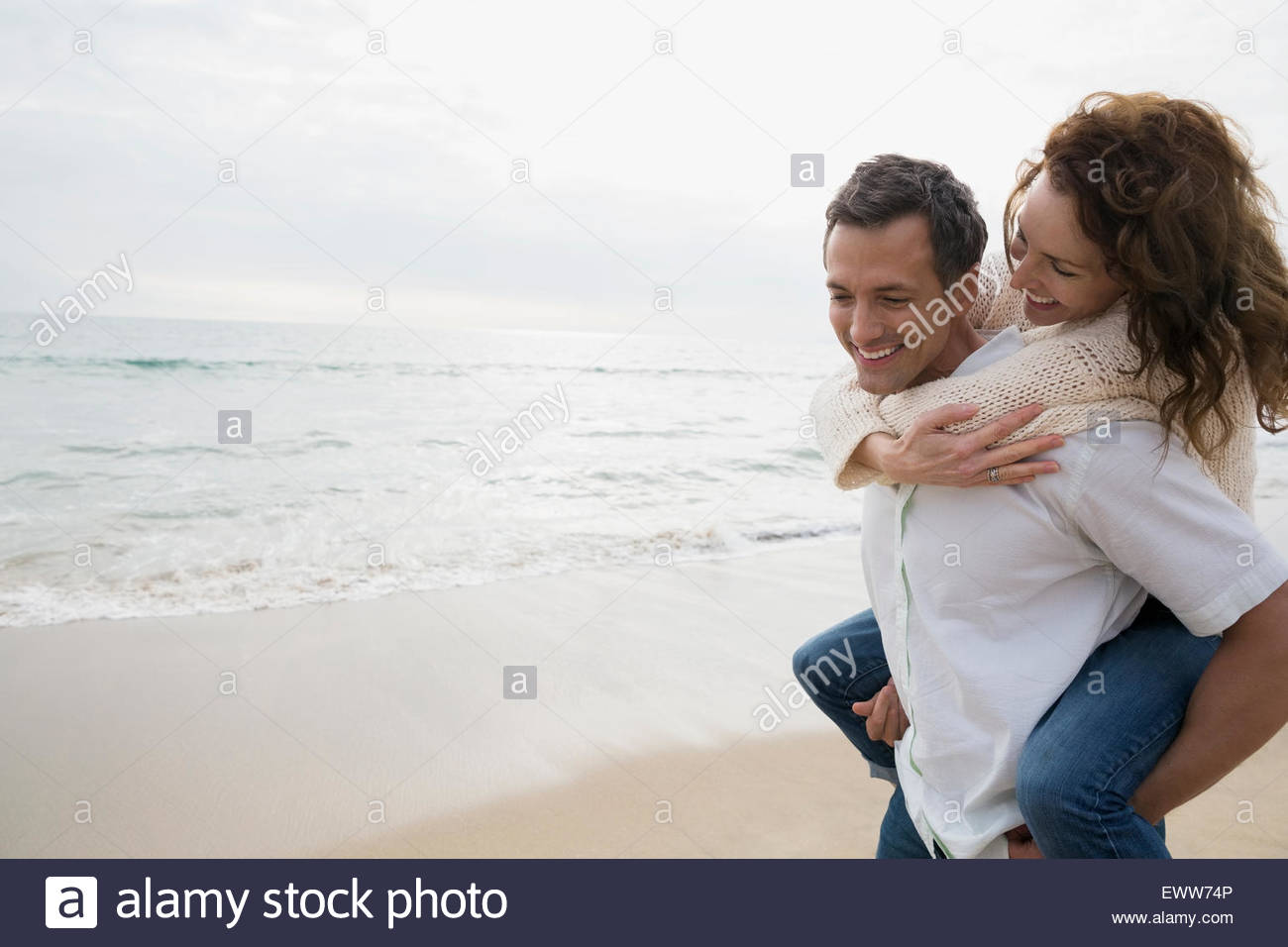 Two couple piggyback beach hi-res stock photography and images - Alamy