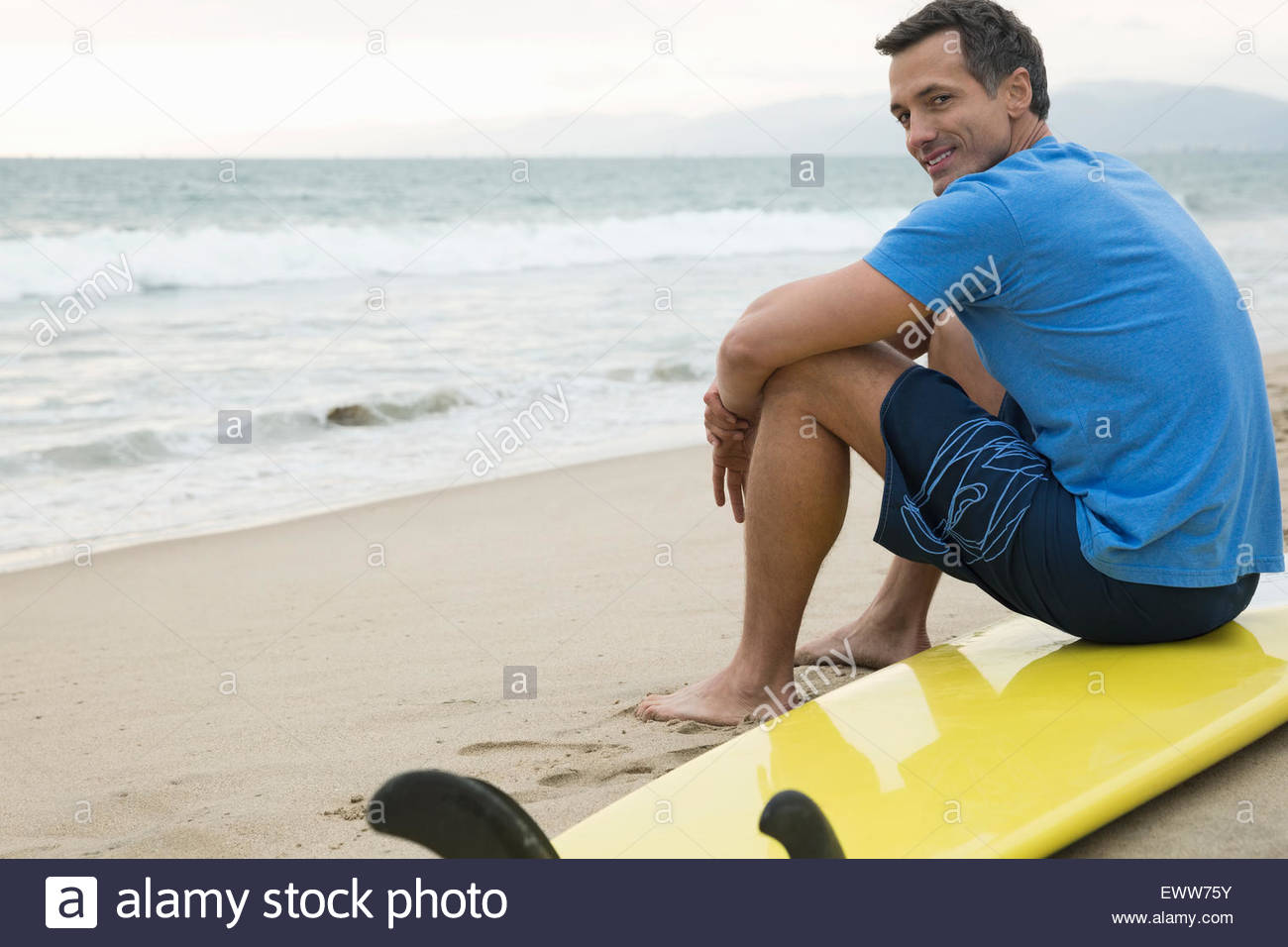 Surfer sitting on surfboard hi-res stock photography and images - Alamy