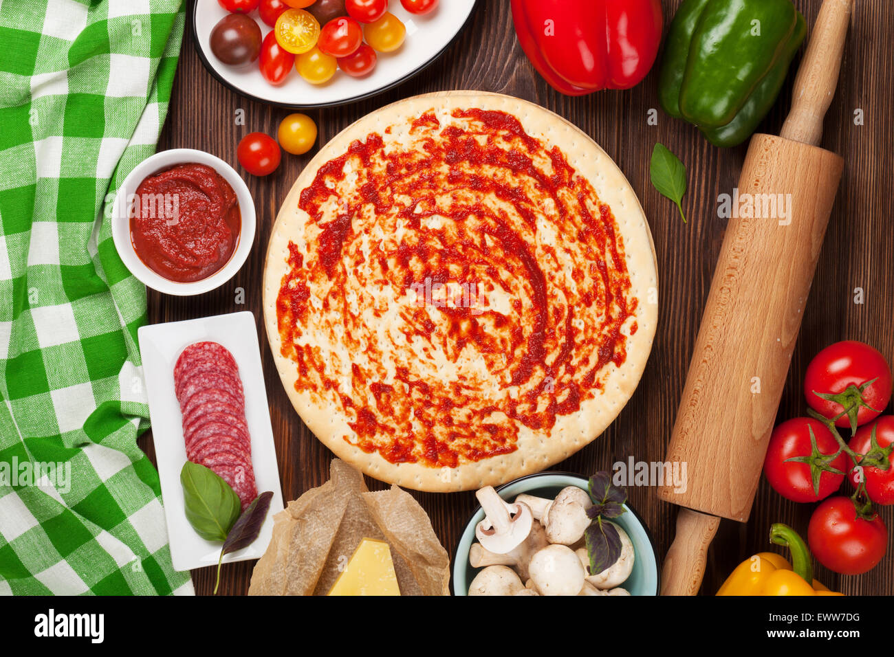 Pizza cooking ingredients. Dough, vegetables and spices. Top view Stock ...