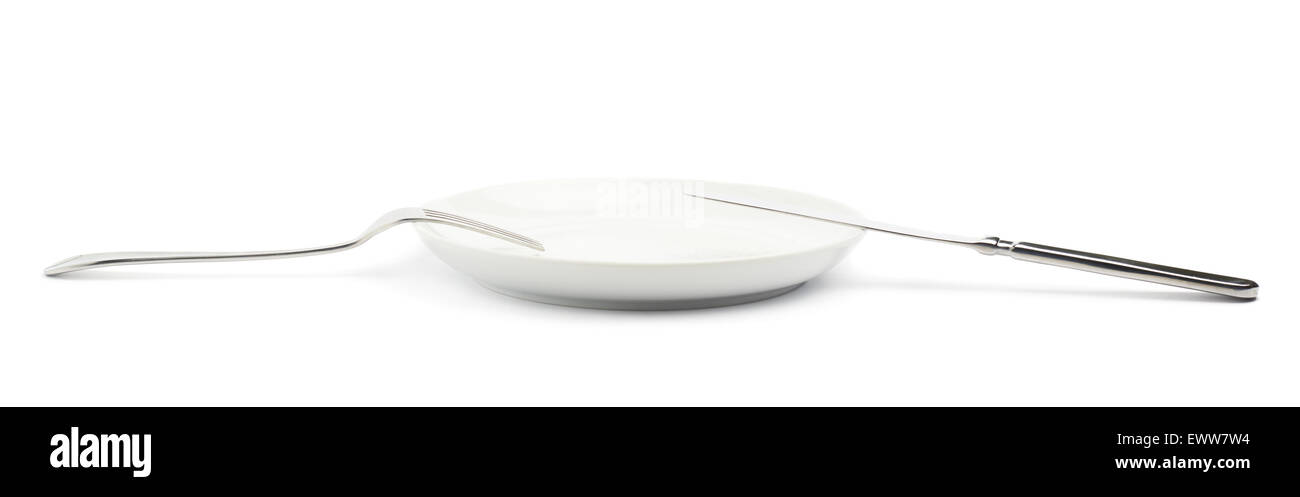 Knife and fork over the plate isolated Stock Photo - Alamy