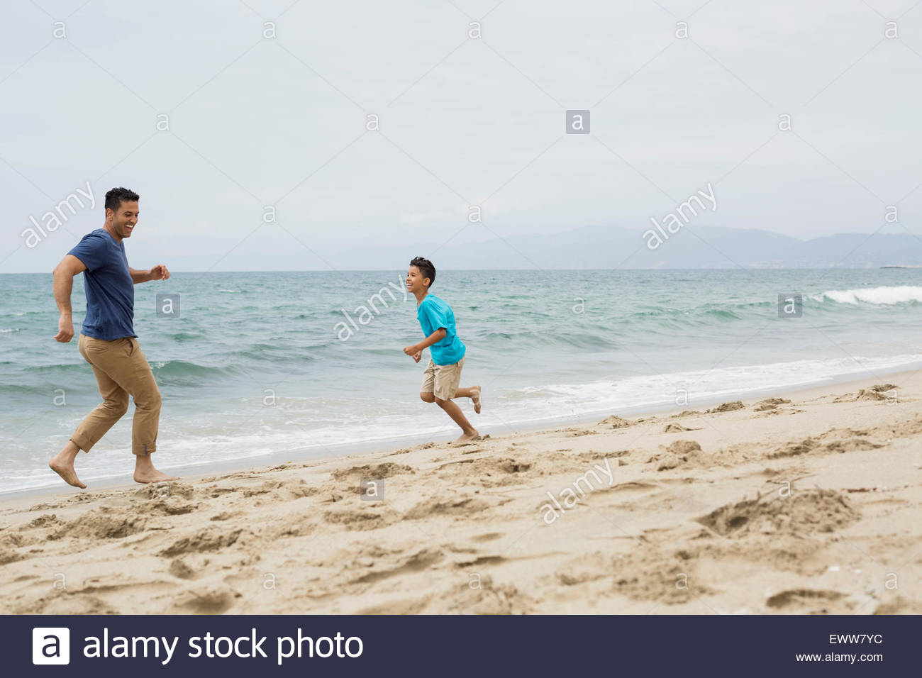 Running father son hi-res stock photography and images - Alamy