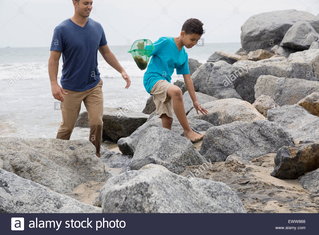 Two boys climbing rock hi-res stock photography and images - Alamy