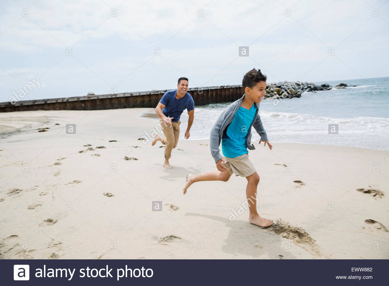 Father son running on the beach hi-res stock photography and images - Alamy