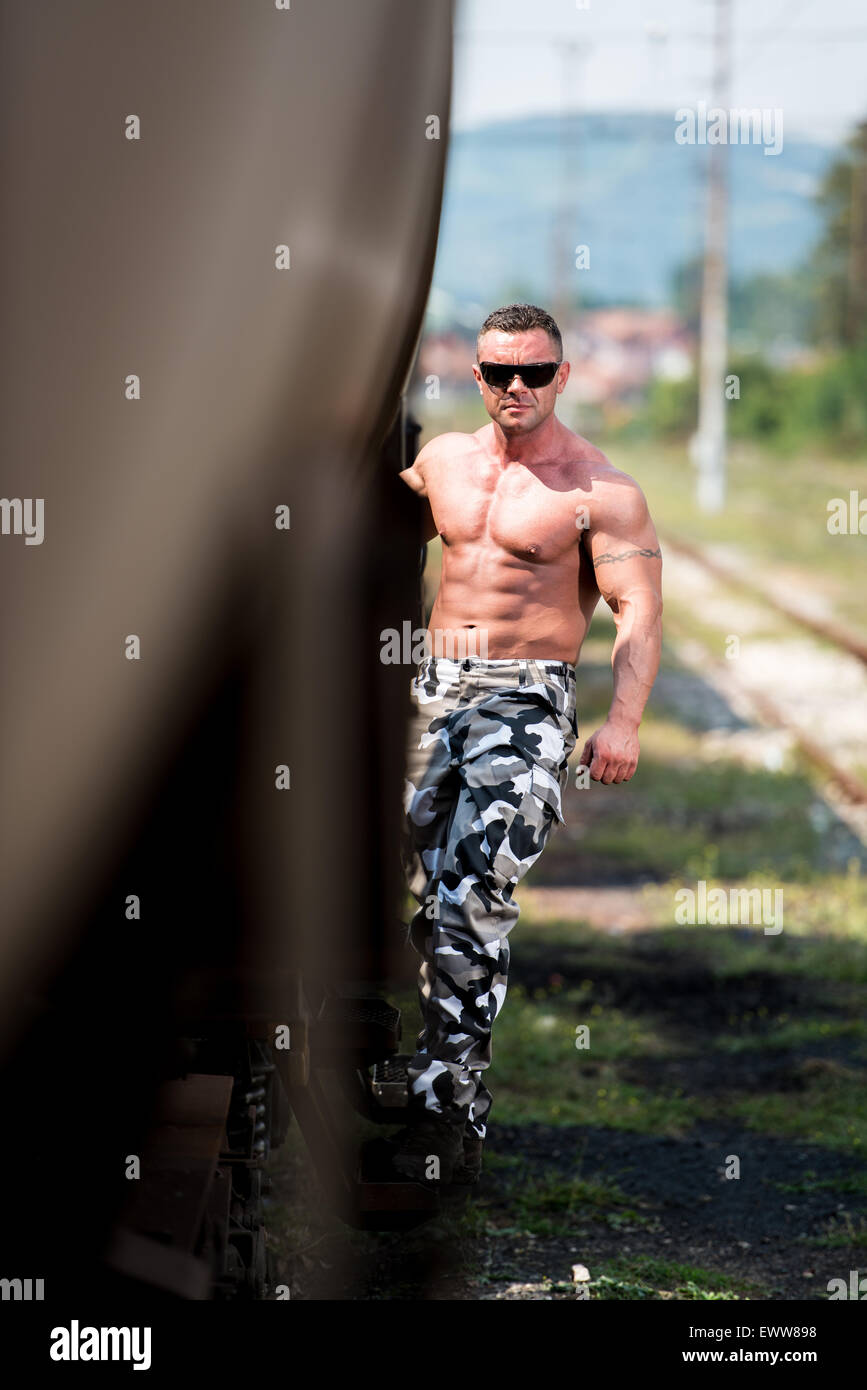 Holding On To Train Stock Photo - Alamy