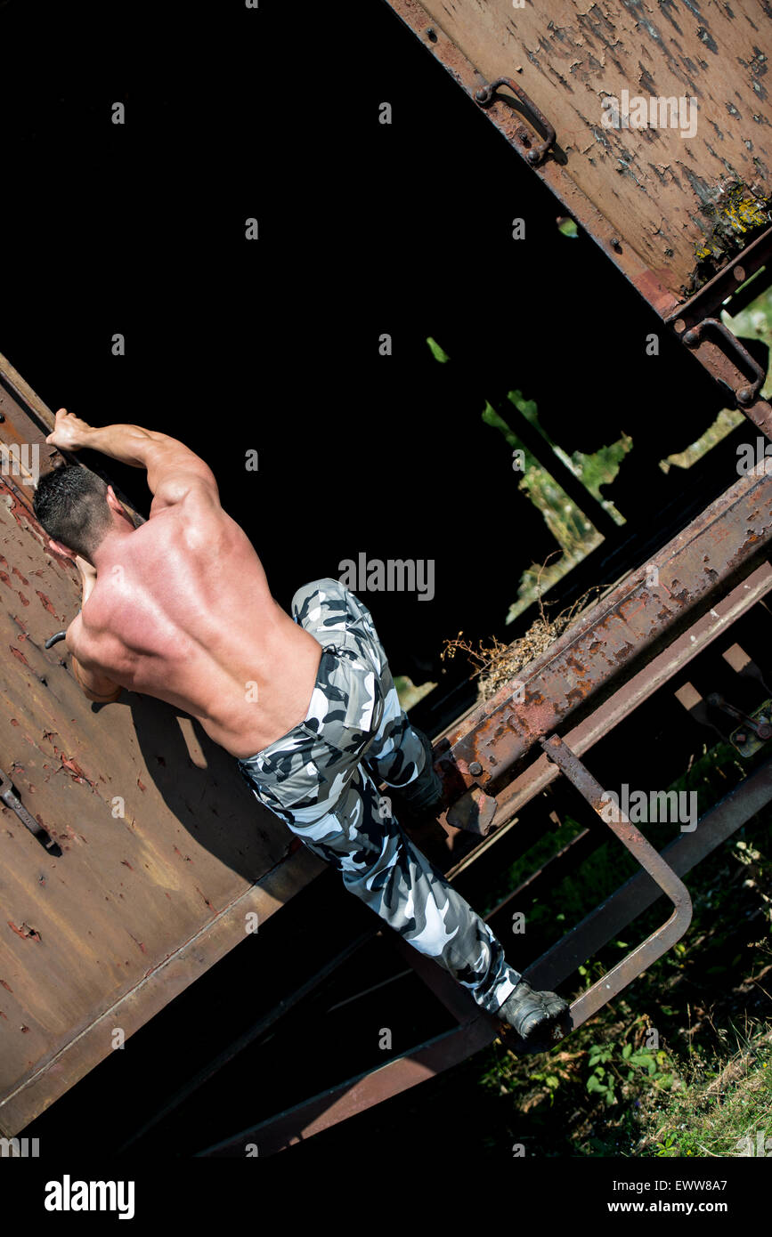 Man Climbing A Ladder Stock Photo - Alamy