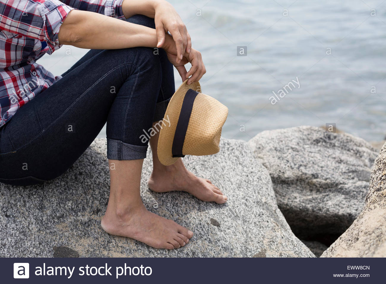 Woman holding rocks hi-res stock photography and images - Alamy