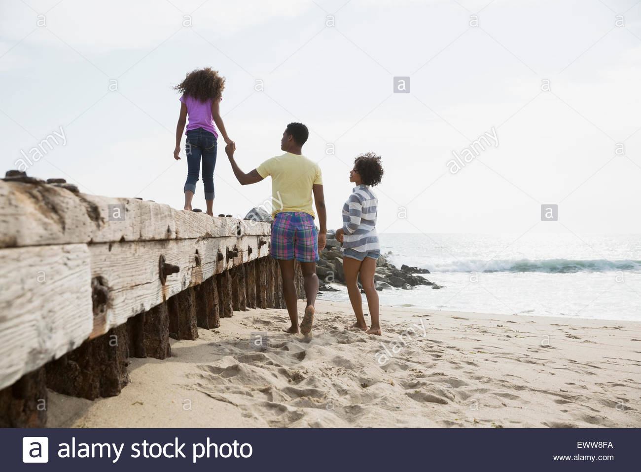 Girl walking along wall hi-res stock photography and images - Alamy