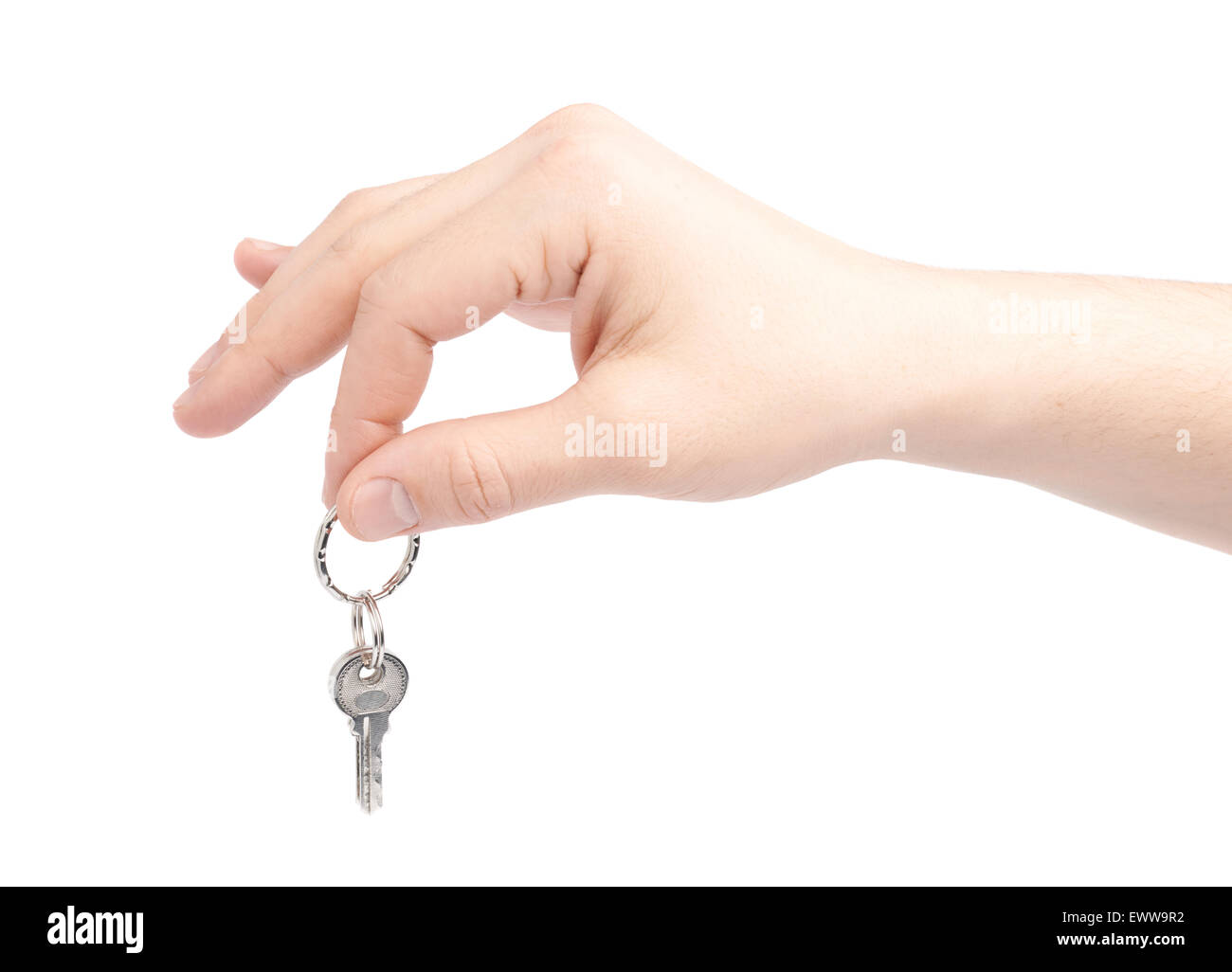 Hand holding a small key Stock Photo - Alamy