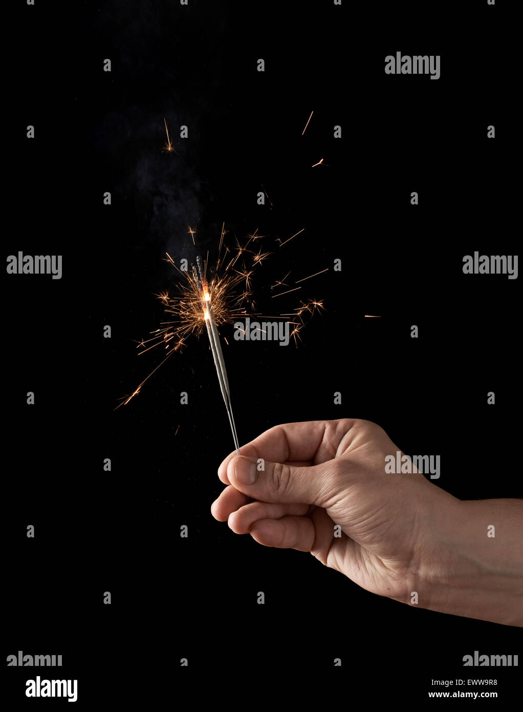 Holding a burning sparkler Stock Photo - Alamy