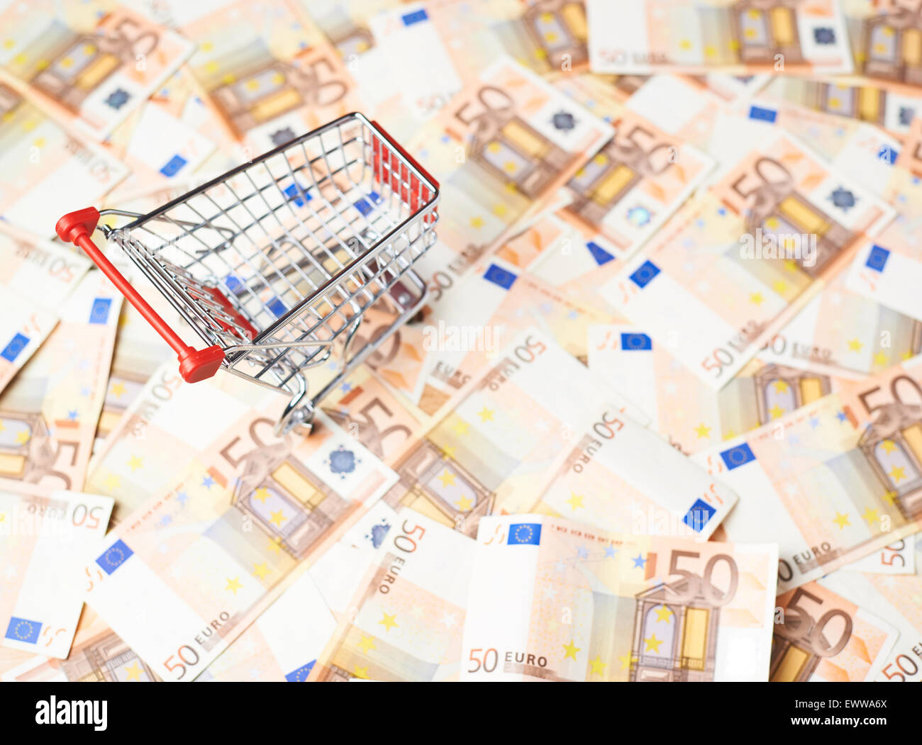 Shopping cart over the bank note bills Stock Photo - Alamy