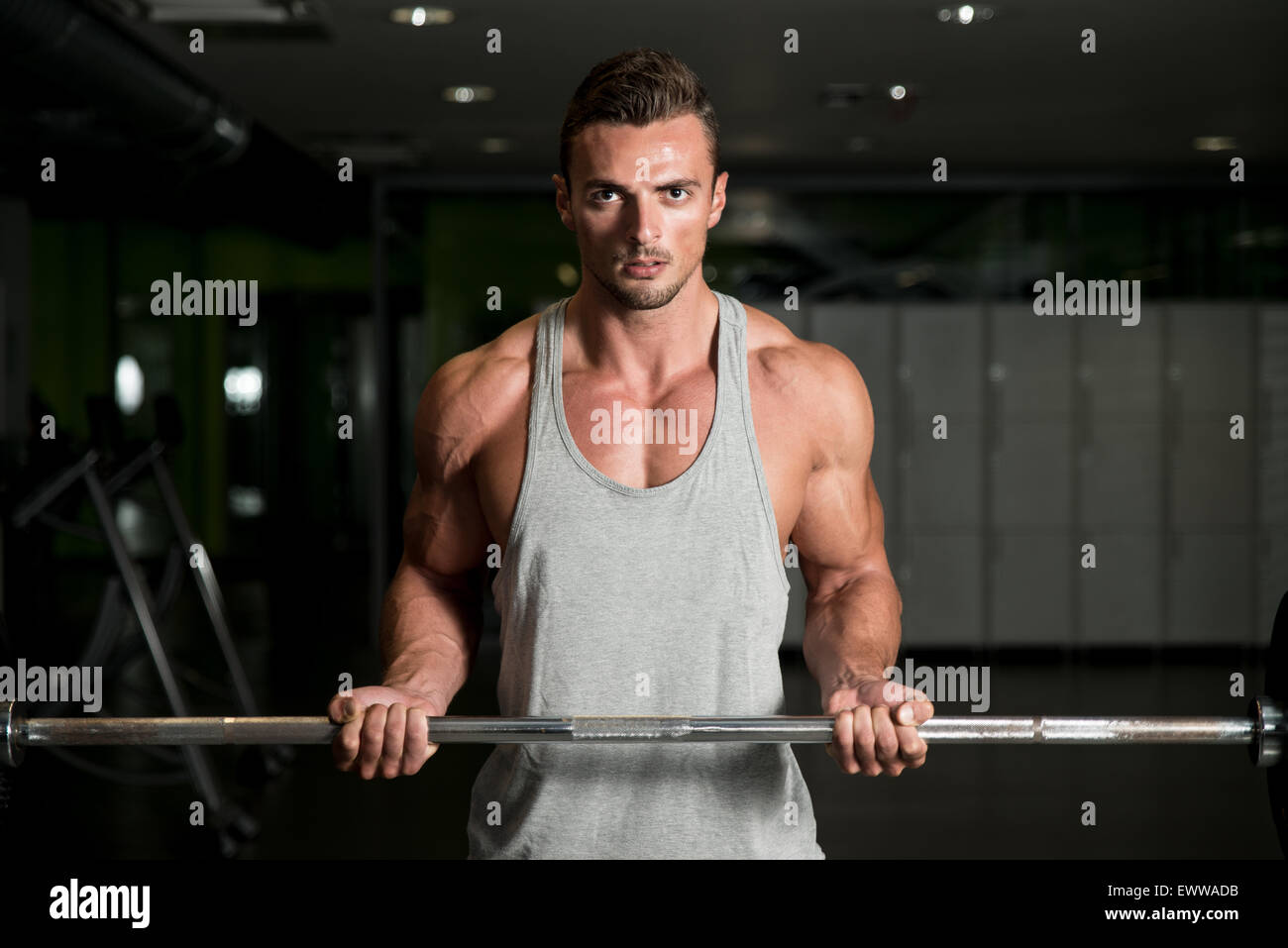 Young Men Doing Heavy Barbell Exercise Stock Photo - Alamy