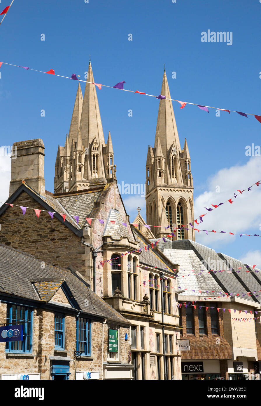 Spires of cathedral rise above historic city centre buildings, Truro ...
