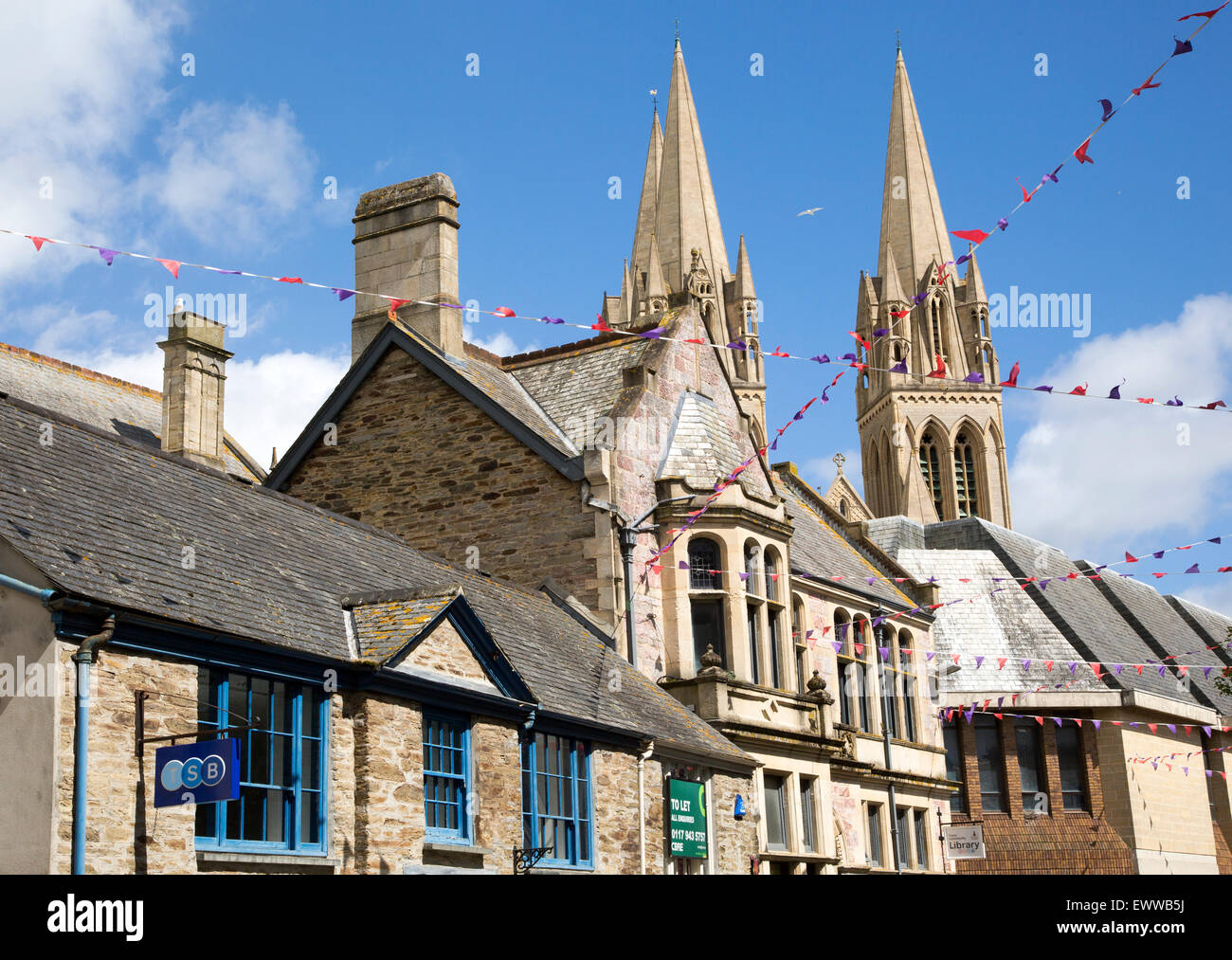 Spires of cathedral rise above historic town centre buildings, Truro ...