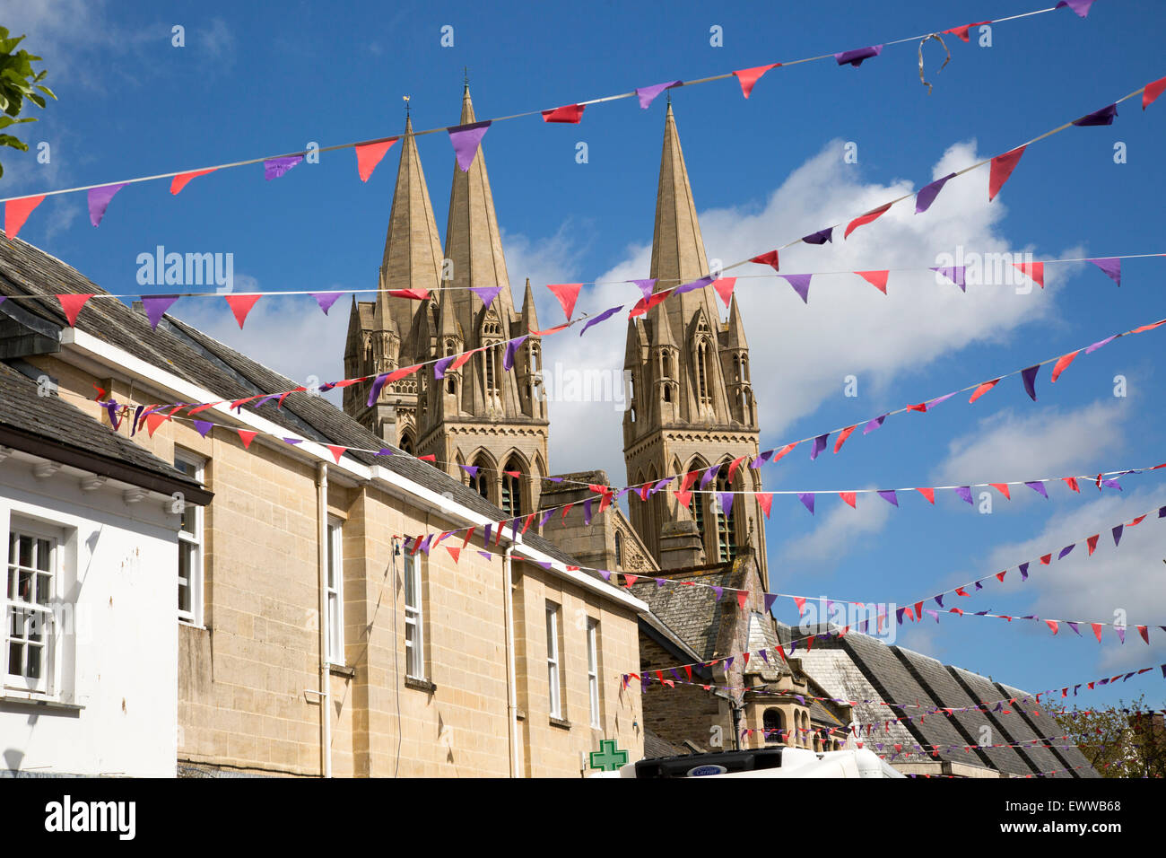 Spires of cathedral rise above historic town centre buildings, Truro ...