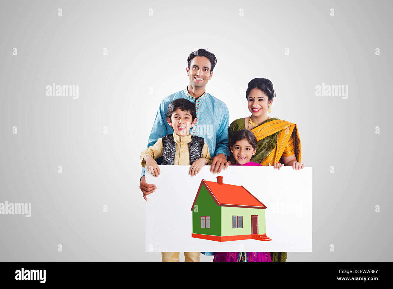 indian Marathi Parents and kids showing Message Board Stock Photo - Alamy