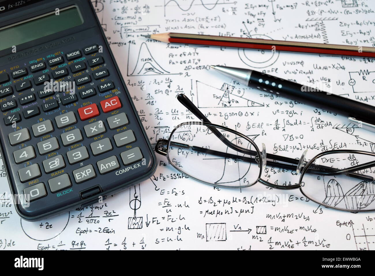 Eye Glasses, pen and pencil over the Formula with calculator Stock ...
