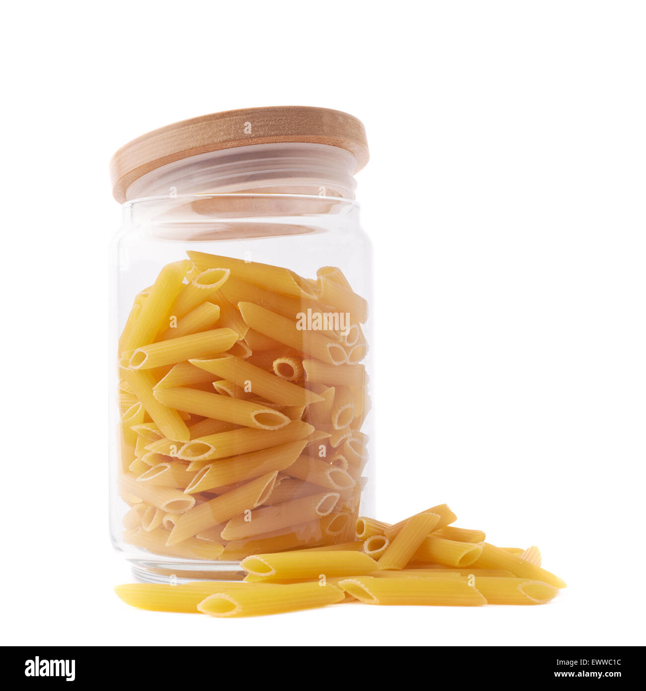 Glass jar filled with penne pasta isolated Stock Photo - Alamy