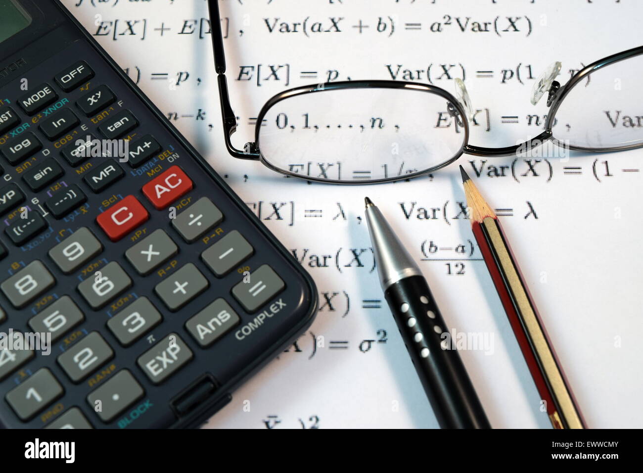 Eye Glasses, pen and pencil over the Formula with calculator Stock ...
