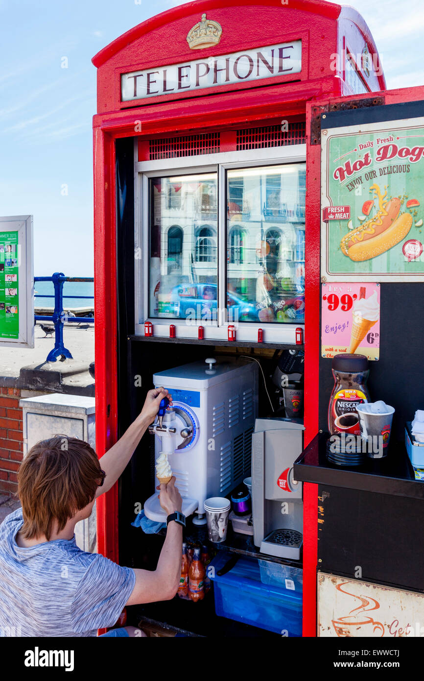 A Man Serves Ice Cream From A Converted Old Red Telephone Box ...