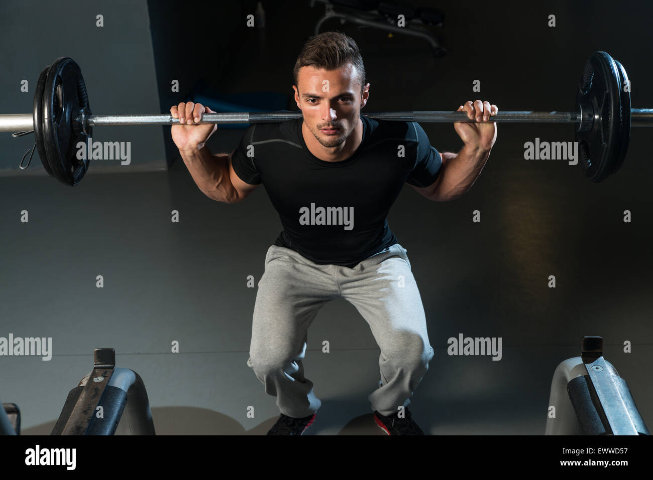 Man Doing Squats Stock Photo - Alamy