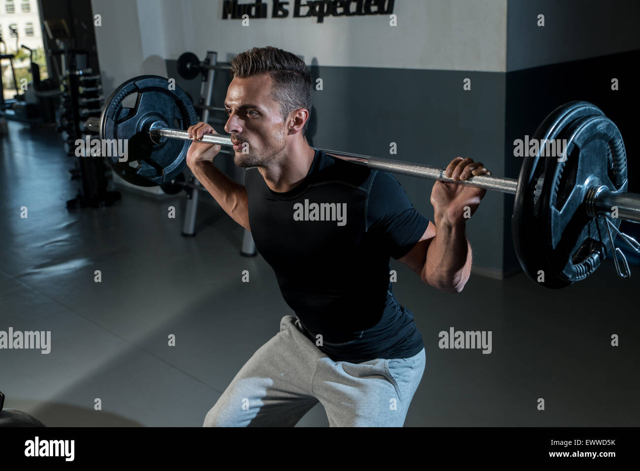 Man Doing Squats Stock Photo - Alamy