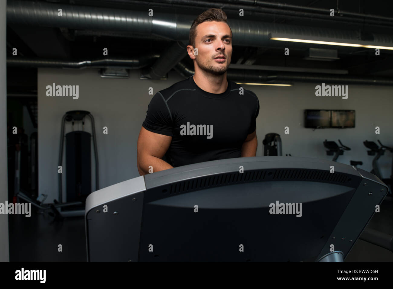 Man Jogging In A Gym Stock Photo - Alamy