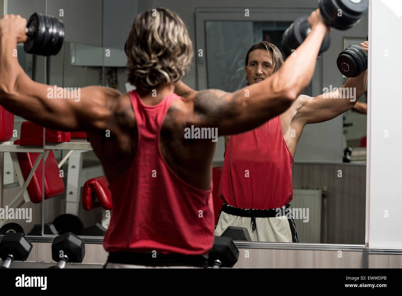 Military Press with Dumbbells Stock Photo - Alamy