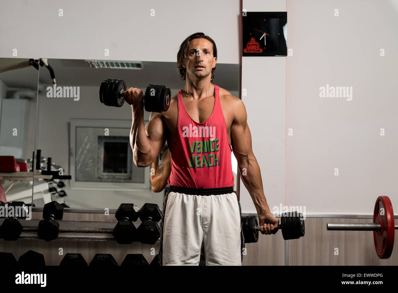 Muscular Man Exercising In Gym Stock Photo - Alamy
